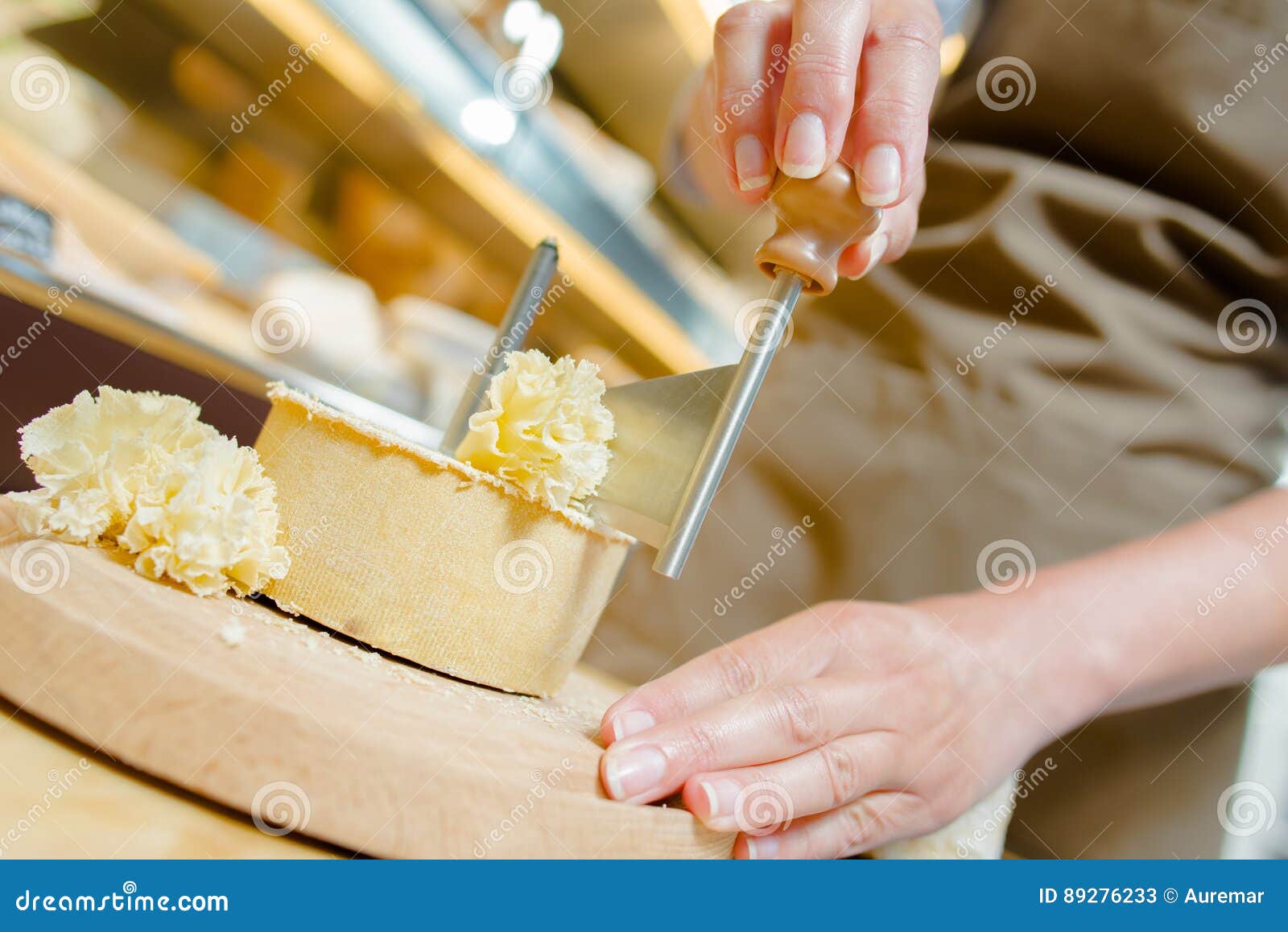 Shaving layers off cheese stock image. Image of food - 89276233