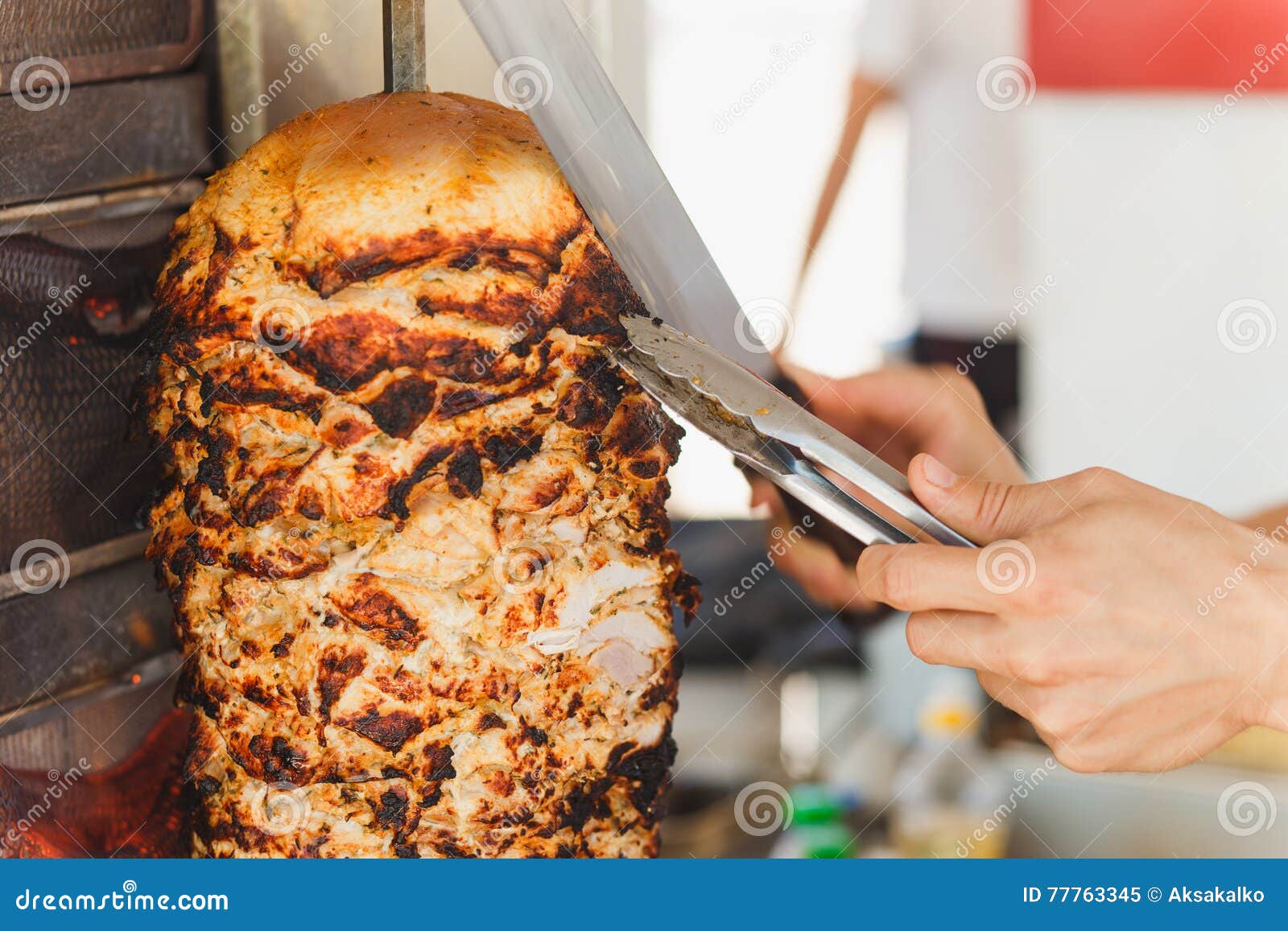 Shawarma meat being cut stock image. Image of giros, rotating - 77763345