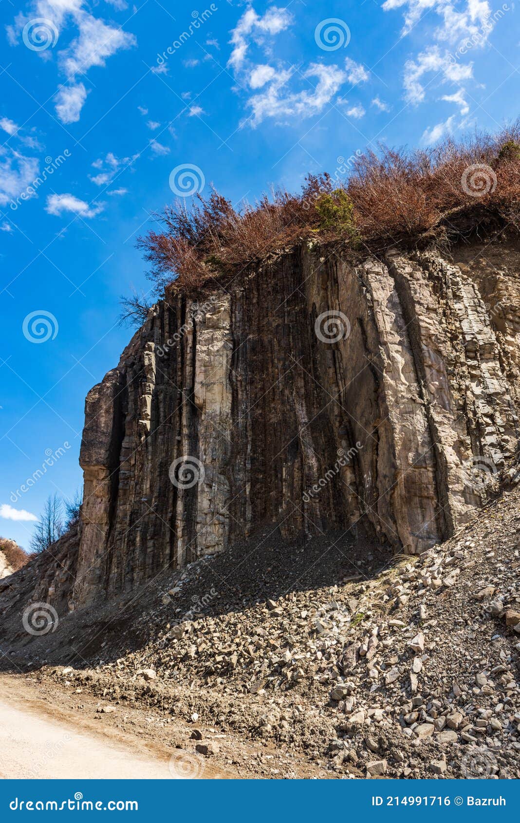 Sheer cliff by the road stock photo. Image of narrow - 214991716