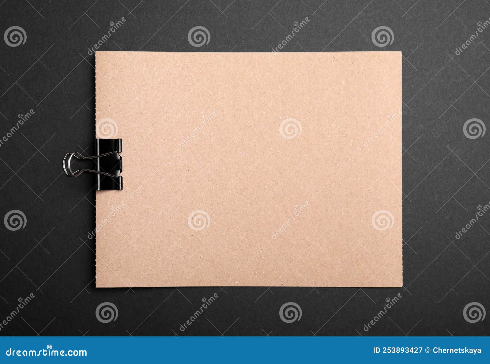 Sheet of Brown Paper with Clip on Black Background, Top View Stock ...