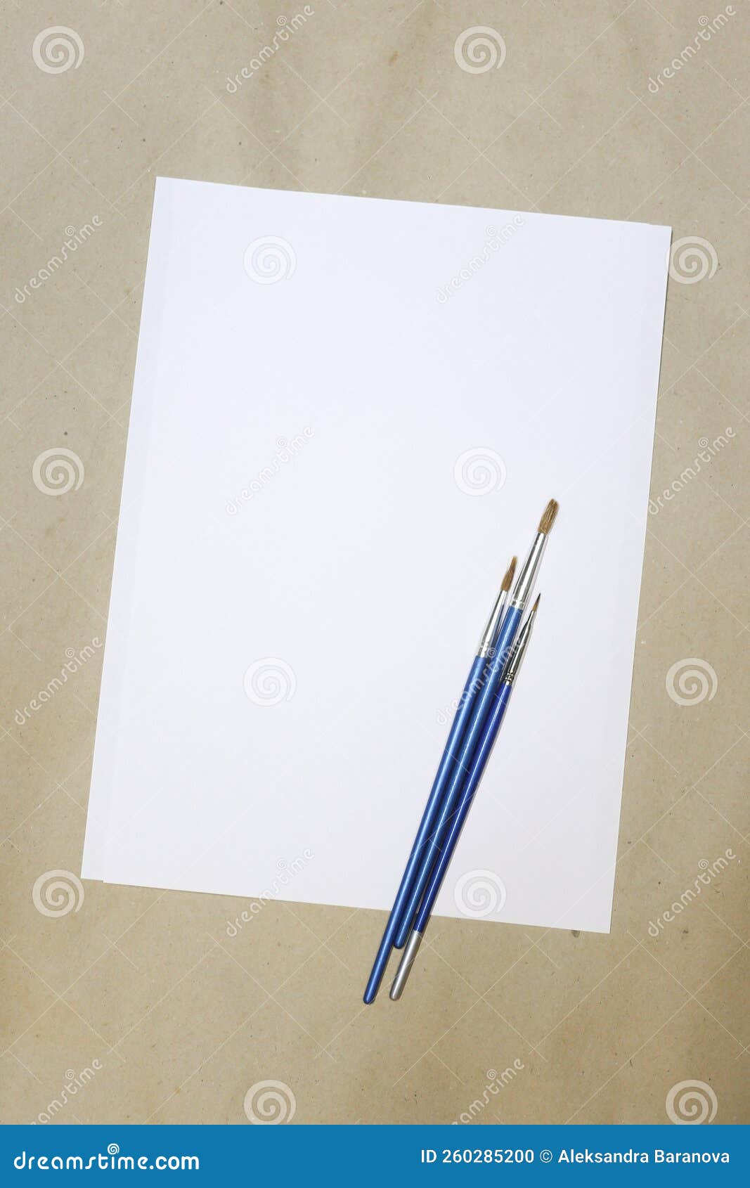 Sheet of White Paper and Artistic Brushes on a Crafting Background ...