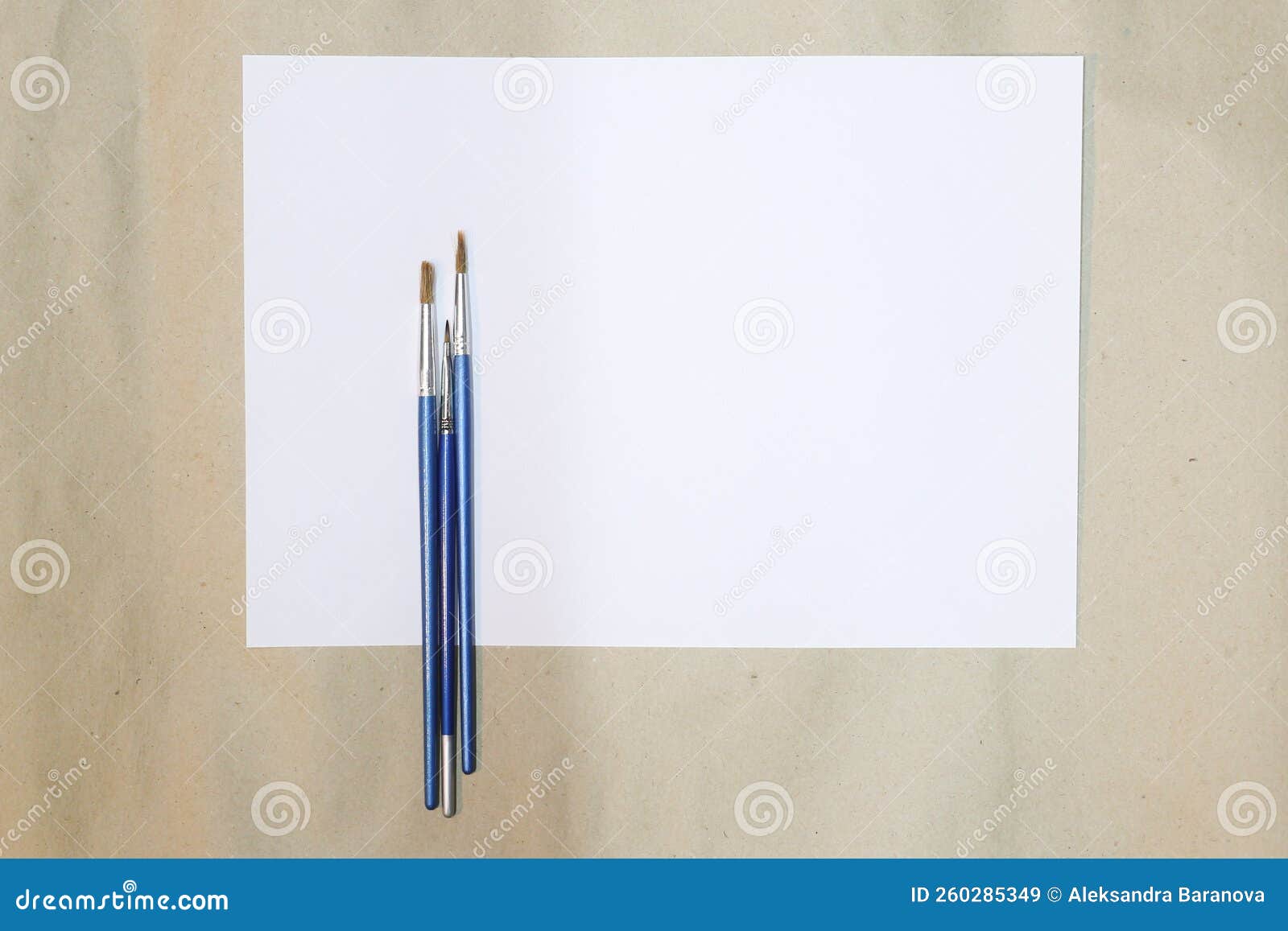 Sheet of White Paper and Artistic Brushes on a Crafting Background ...