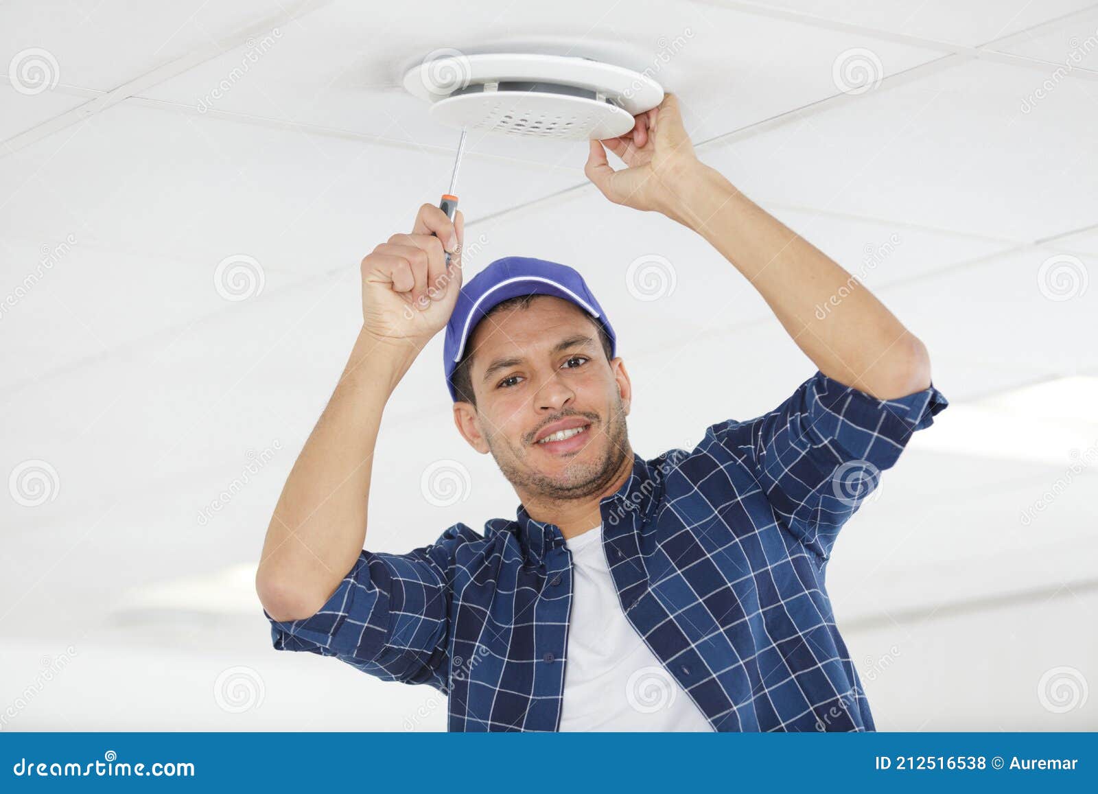 Sheetrocker Drilling Screws into Ceiling Stock Photo - Image of worker ...