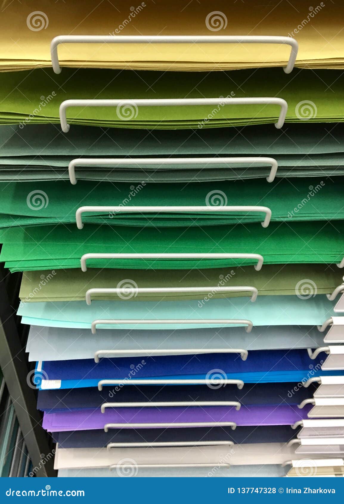 Sheets of Colored Paper Folded in a Row Stock Photo - Image of yellow ...