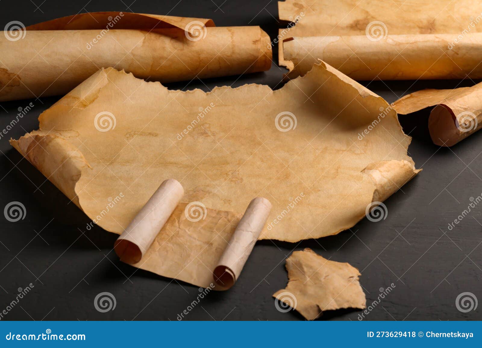 Sheets of Old Parchment Paper on Grey Wooden Table Stock Photo - Image ...