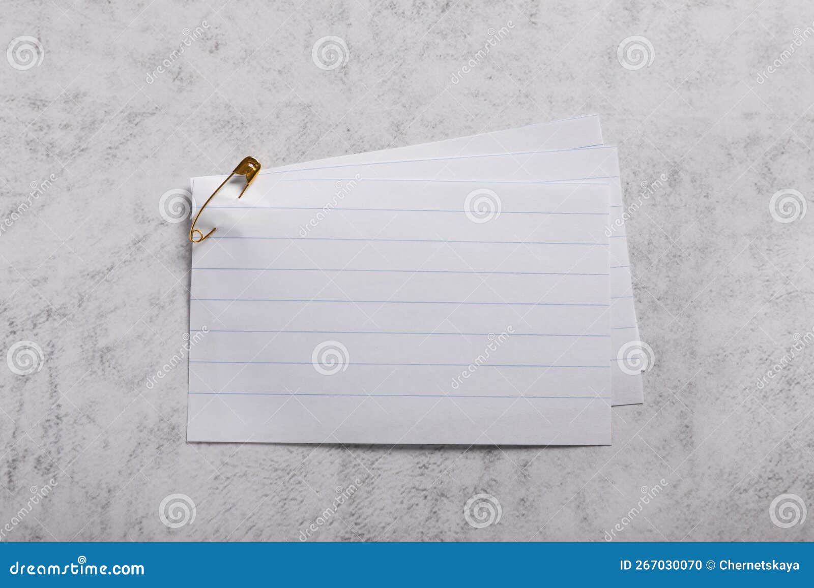 Sheets of Paper Attached with Safety Pin on Grey Textured Background ...