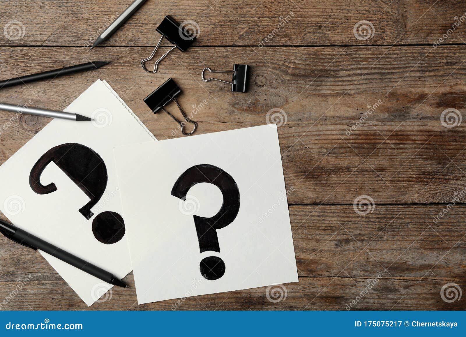 Sheets of Paper with Question Marks and Stationery on Table, Flat Lay ...