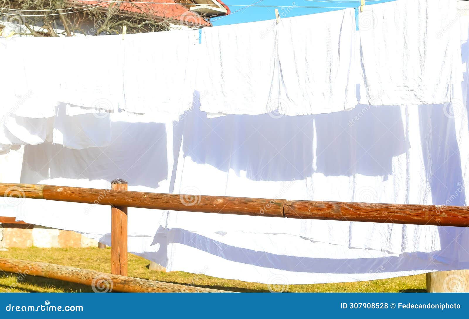 Sheets and Tablecloths Hanging in the Sun To Dry after Washing Stock ...
