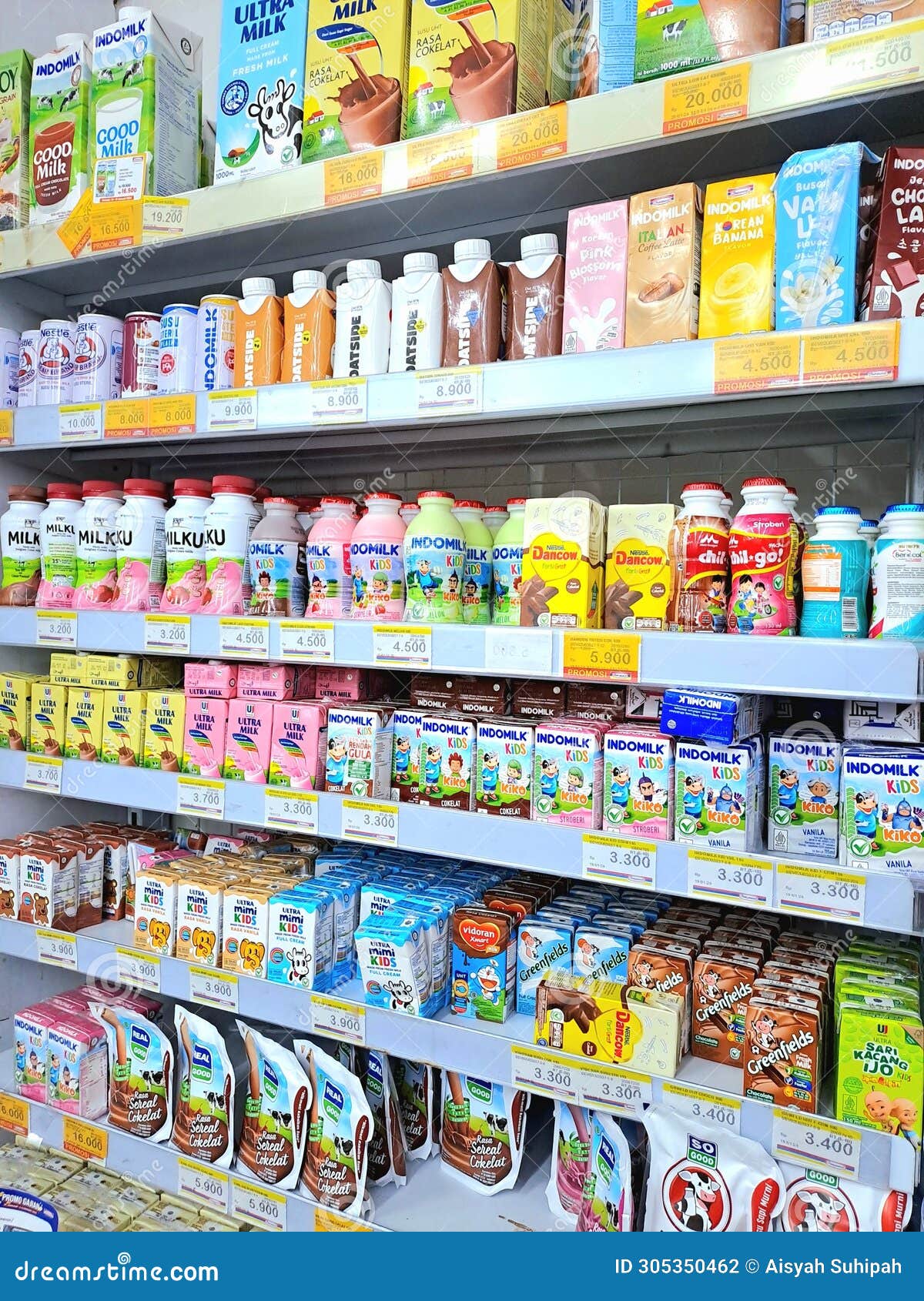 A Shelf Containing Various Kinds of Packaged Milk in a Supermarket ...