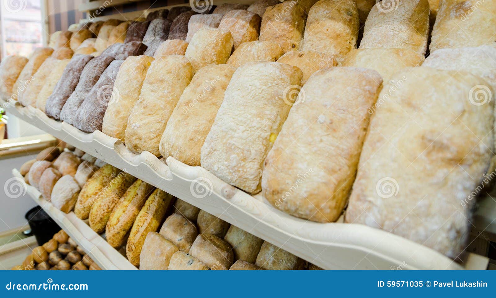 Shelf with fresh bread stock image. Image of showcase - 59571035