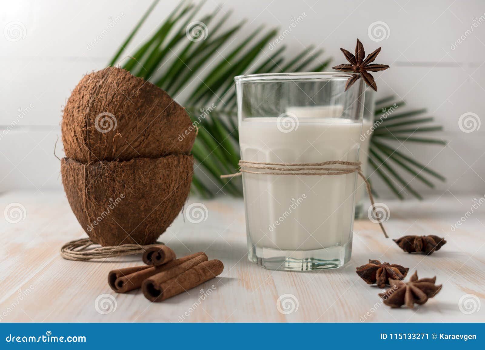 Shell of Coconut and Coconut Milk in Glass with Cinnamon Stock Image ...