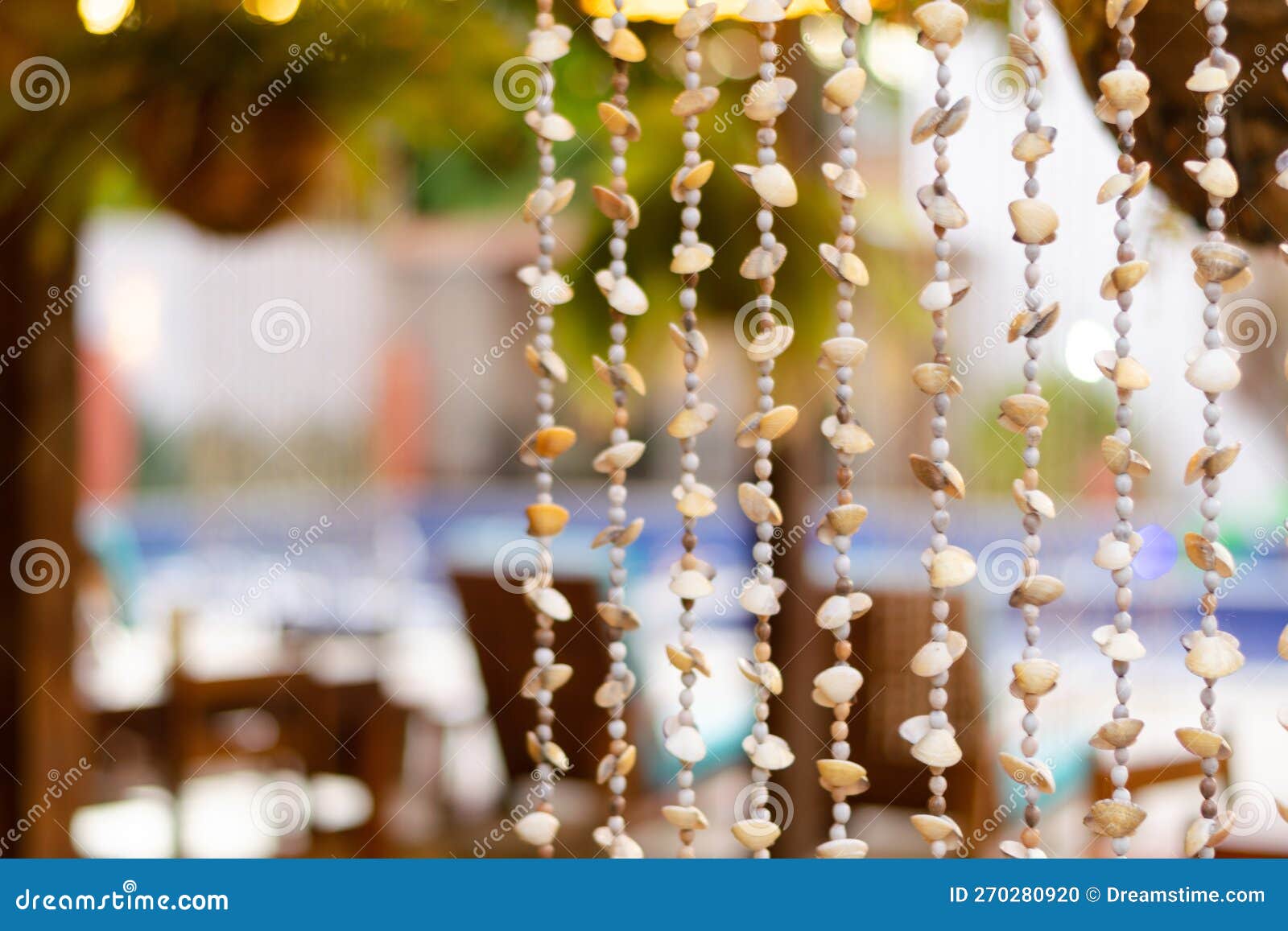 Shell Curtain with Blurred Pool in the Background and Blurred Pool ...
