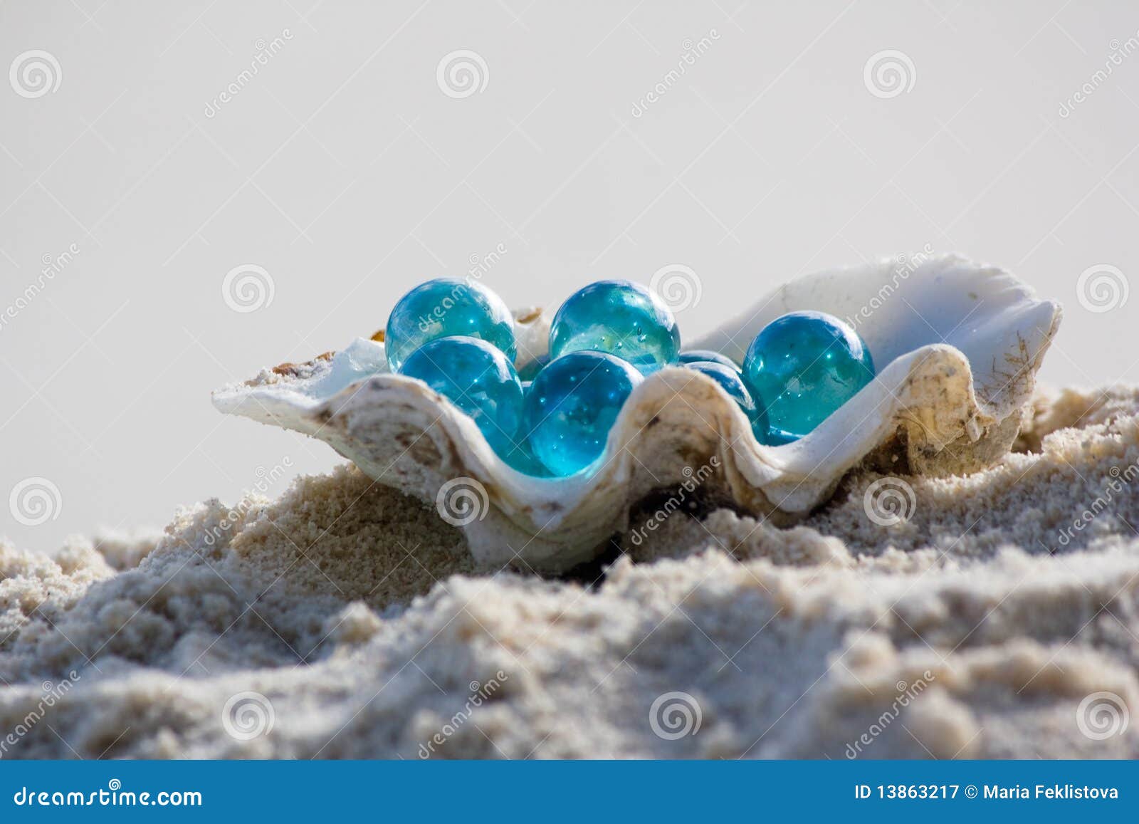 Shell with Glass Pebbles on Sand Stock Image - Image of colorful, glass ...