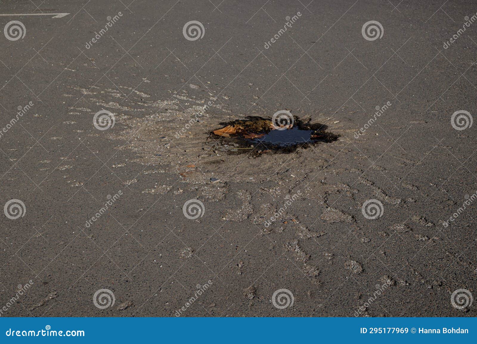 A shell hole in the road editorial stock image. Image of danger - 295177969