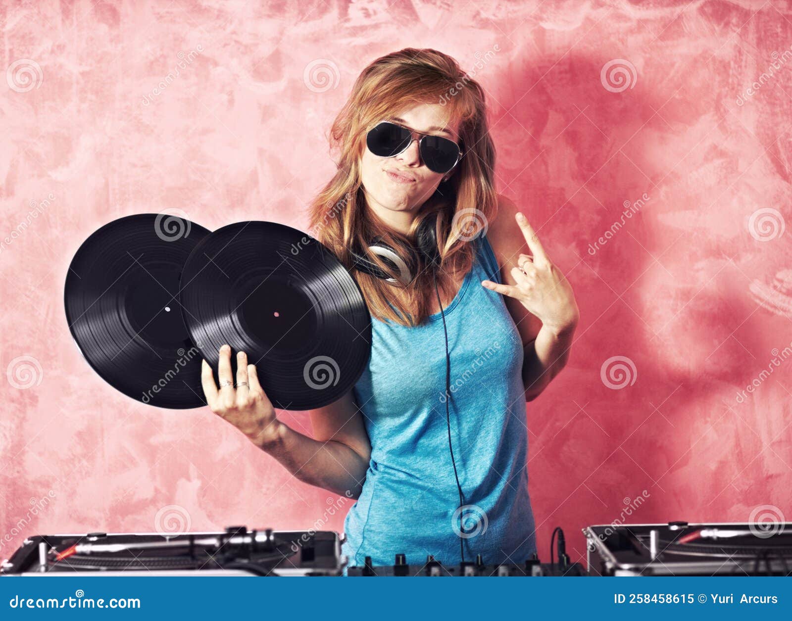 Shell Keep You Entertained. a Young Female Dj Gesturing and Holding ...