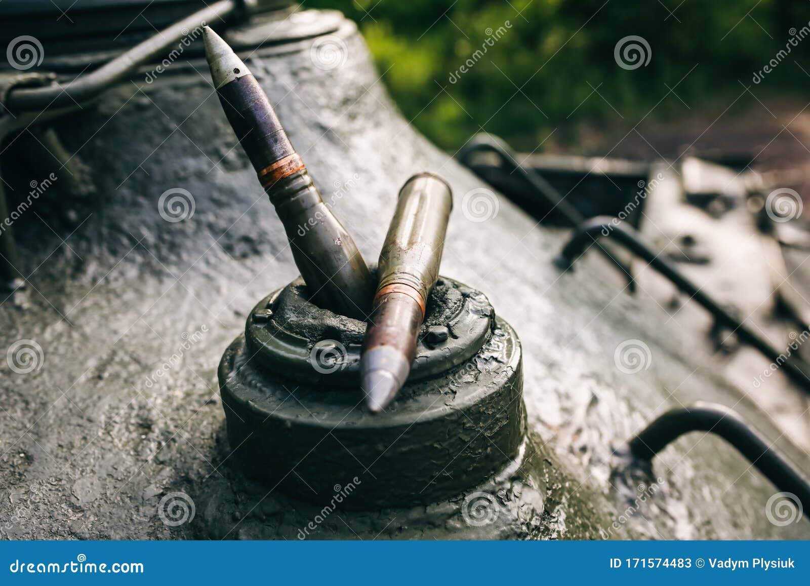 Shell Missile Is Lying On The Old Khaki Peeling Paint Of Armored ...