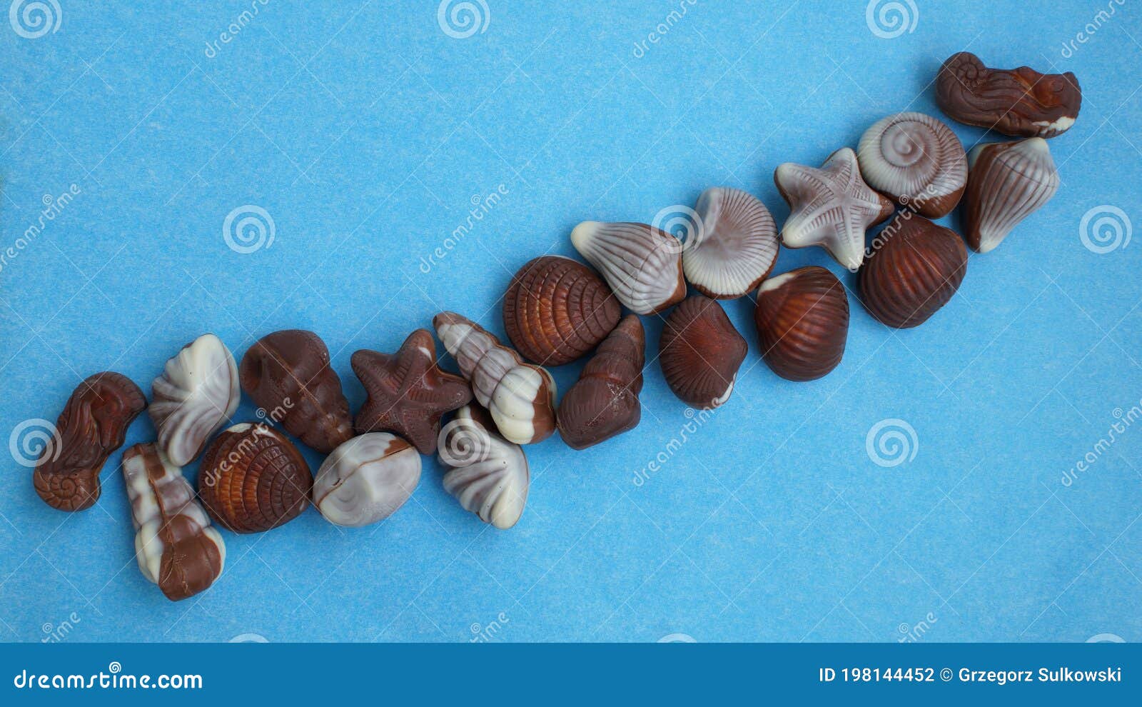 Shell-shaped Chocolates Lying Over Blue Background Stock Photo - Image ...