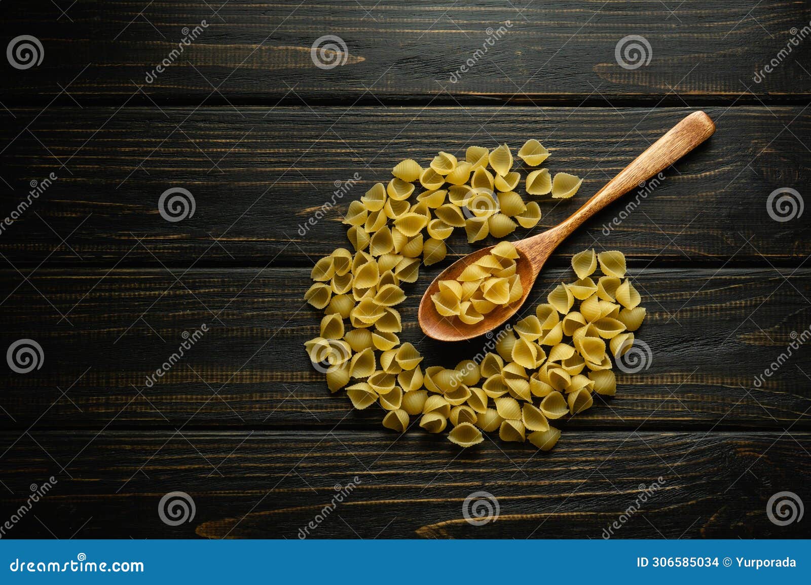 Shell-type Pasta on an Antique Dark Table and in a Spoon before ...