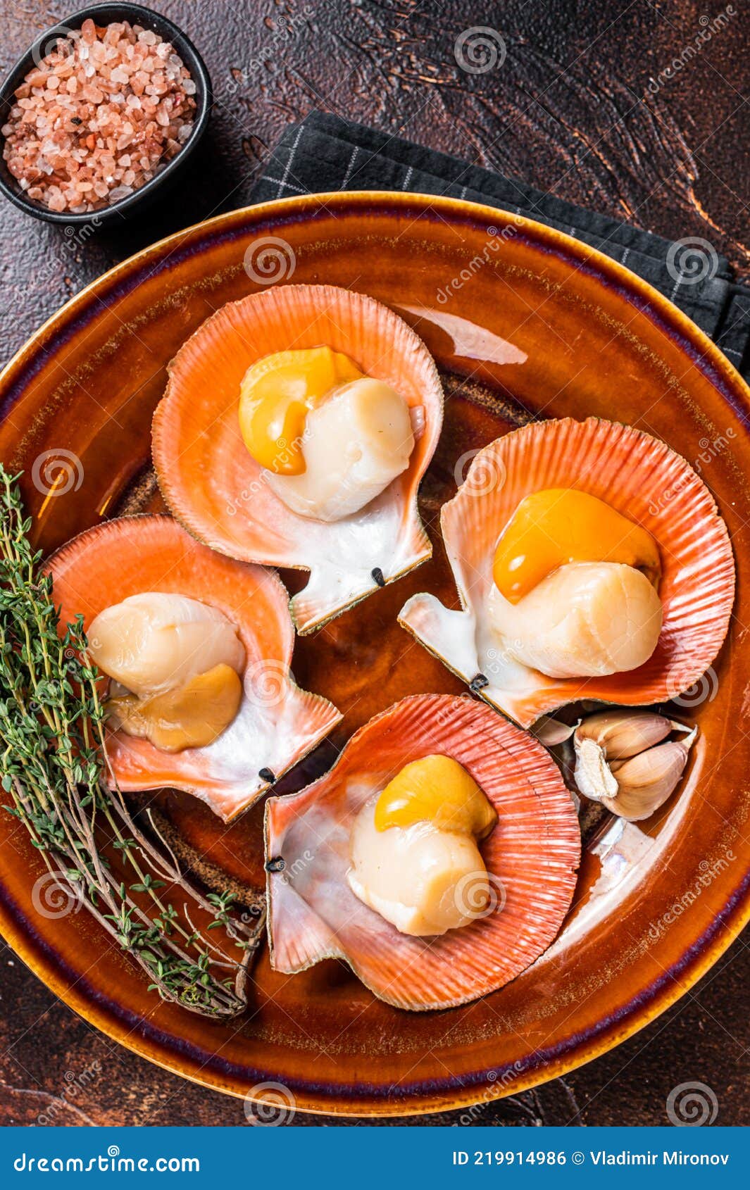 Shellfish Raw Scallops on a Rustic Plate with Thyme. Dark Background ...