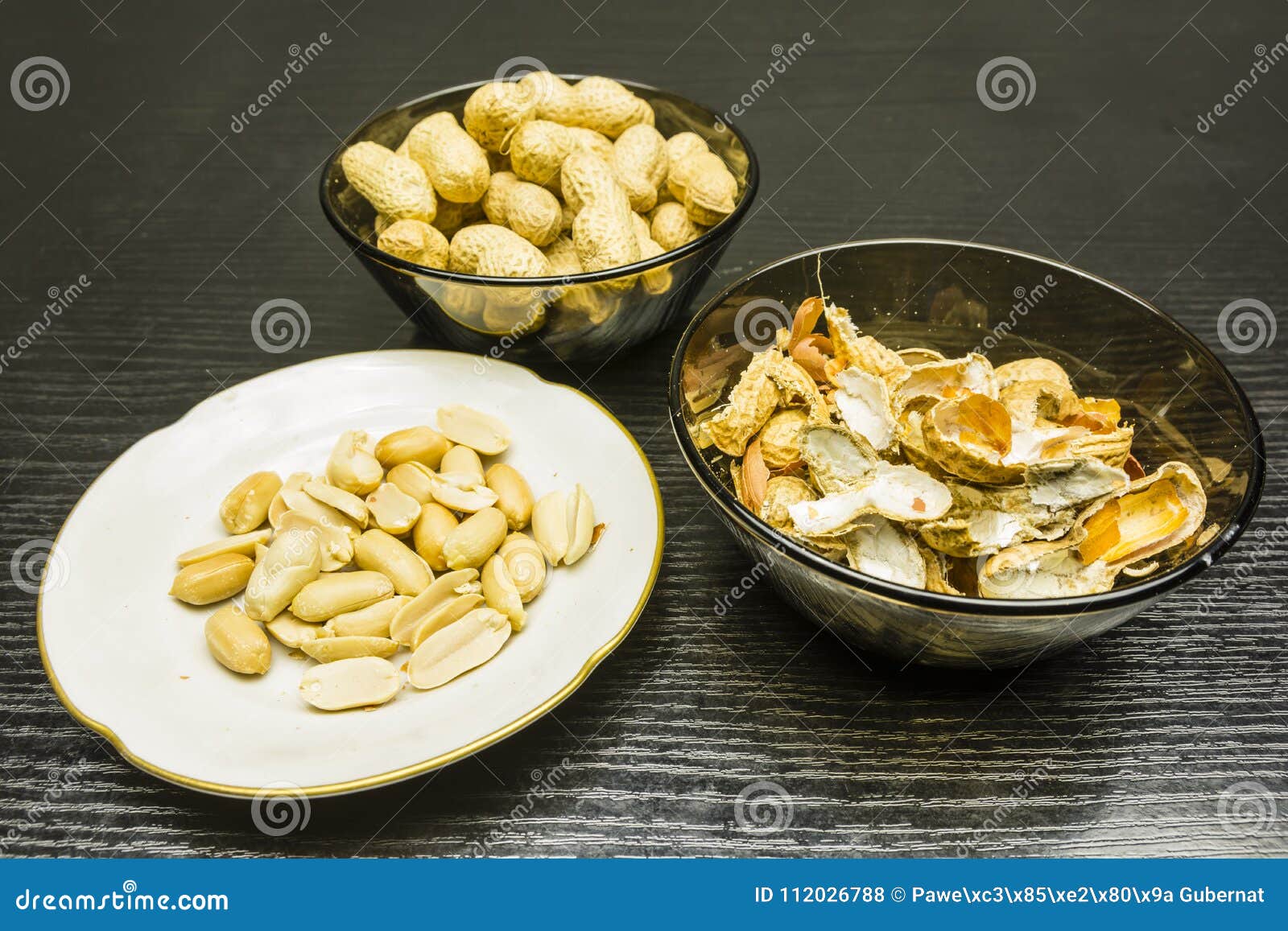 Peeling Peanuts. a Bowl of Peels and Clean Peanuts on the Plate. Stock ...