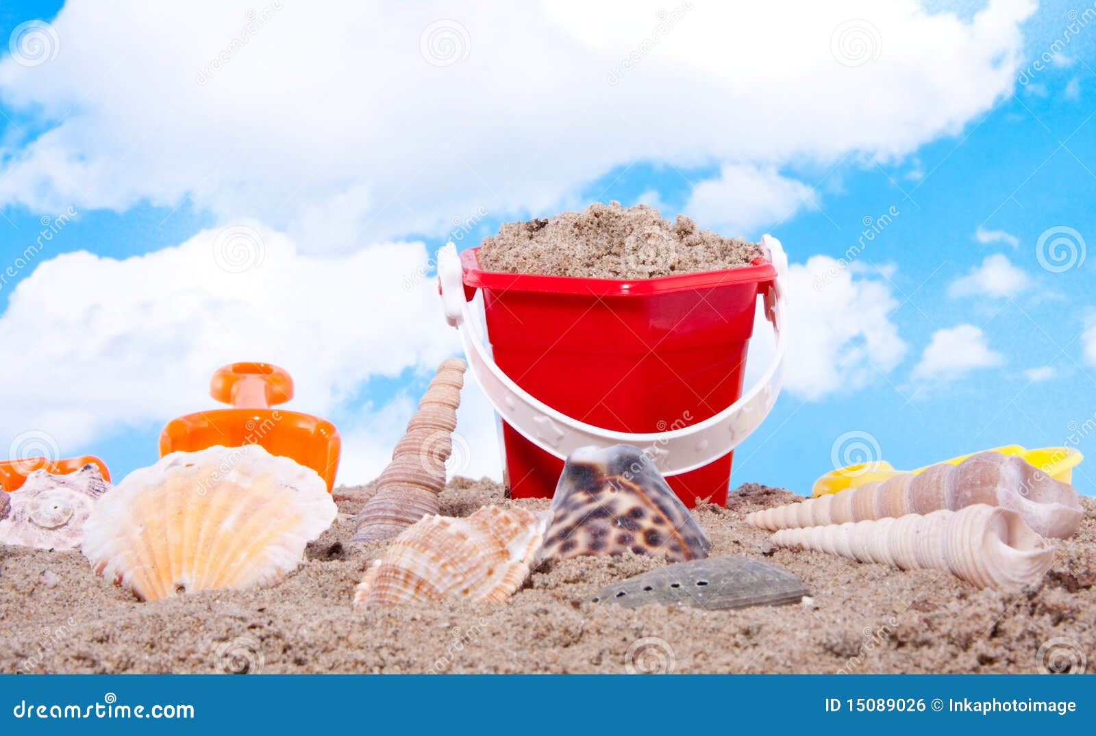 Shells and Plastic Beach Toys Stock Photo - Image of clouds, sieve ...