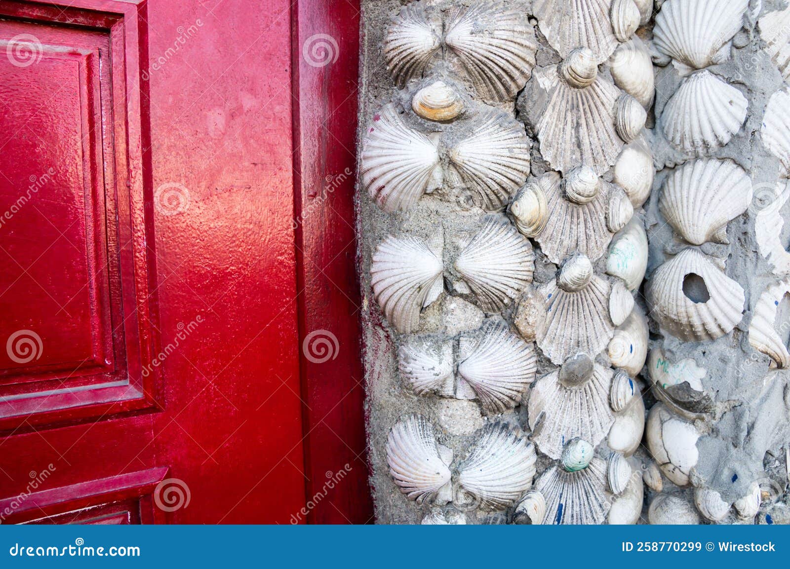 Shells wall and red door stock image. Image of design - 258770299