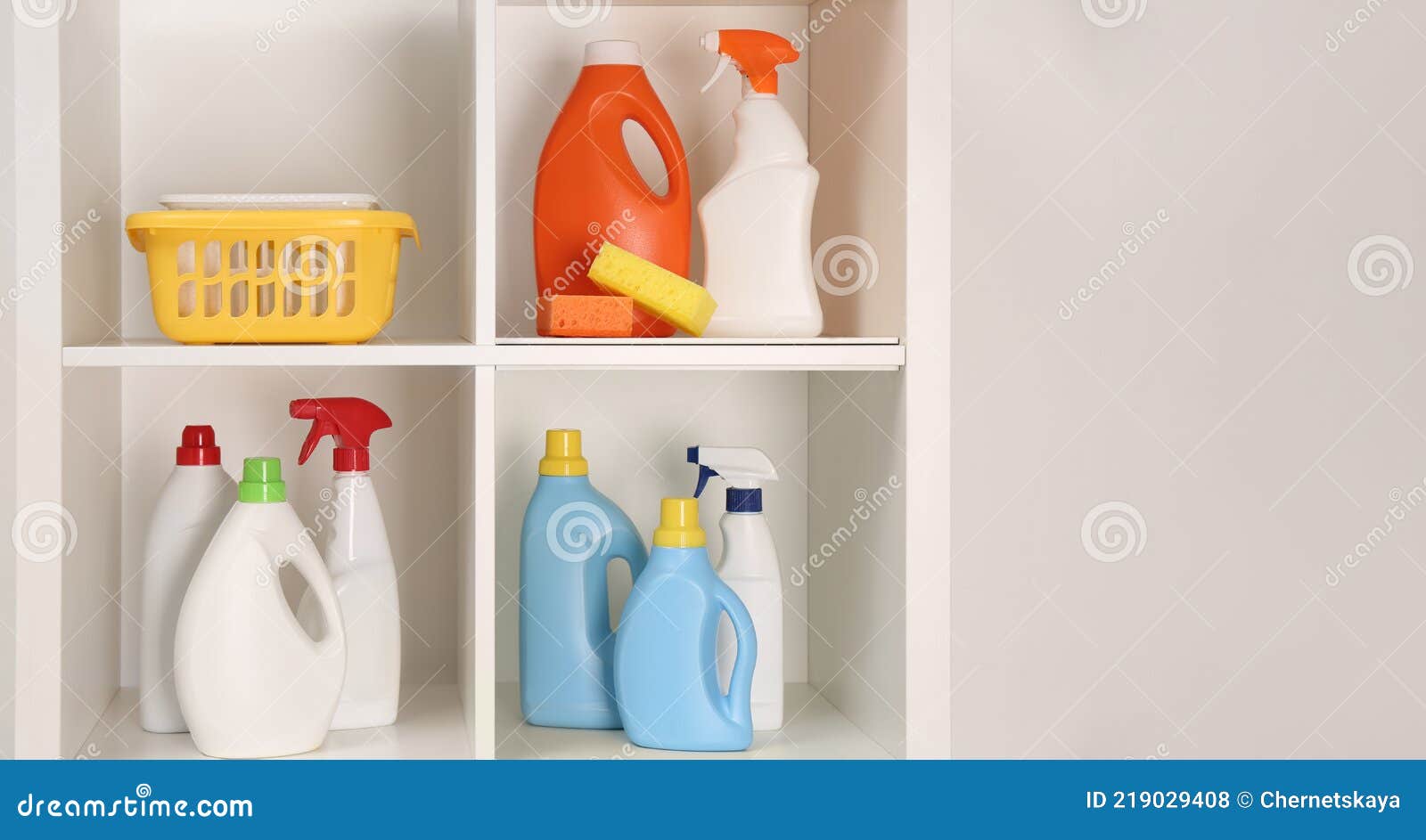 Shelving Unit with Different Cleaning Supplies and Tools Near White ...