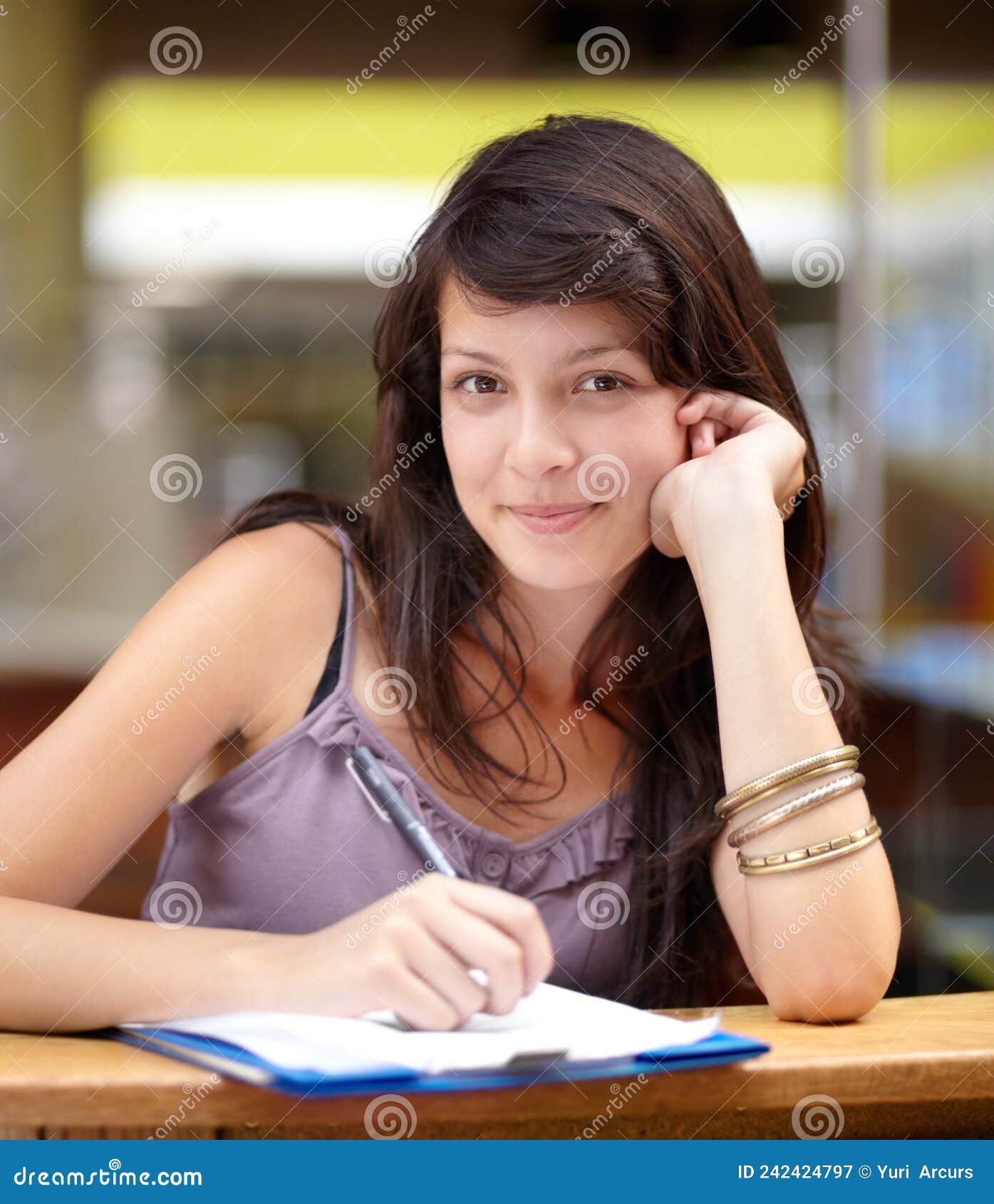 Shes A Diligent Student. A Young Attractive Indian Woman Taking Notes ...