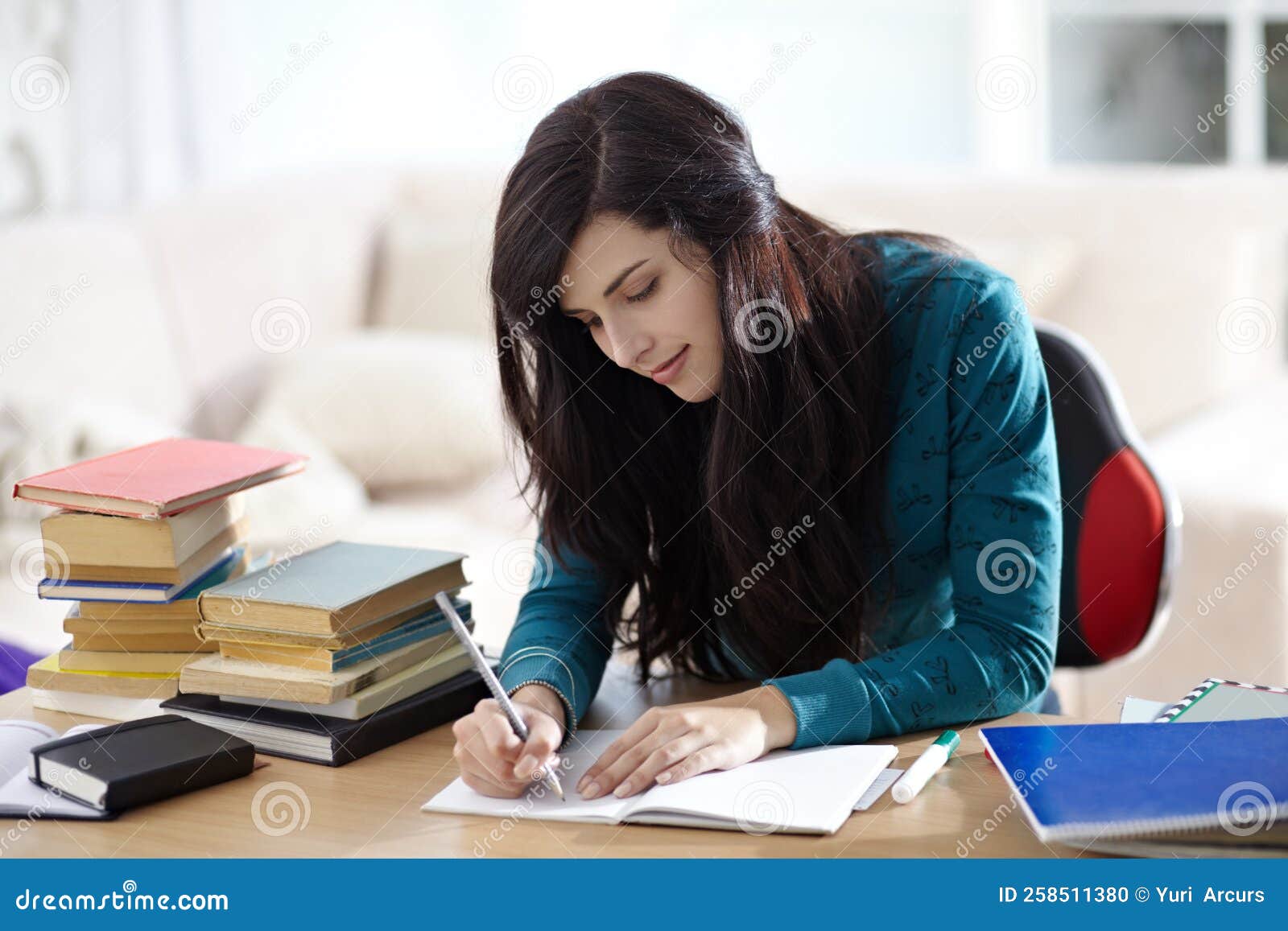 Shes a Focused Student. Attractive Young Student Sitting at a Desk and ...