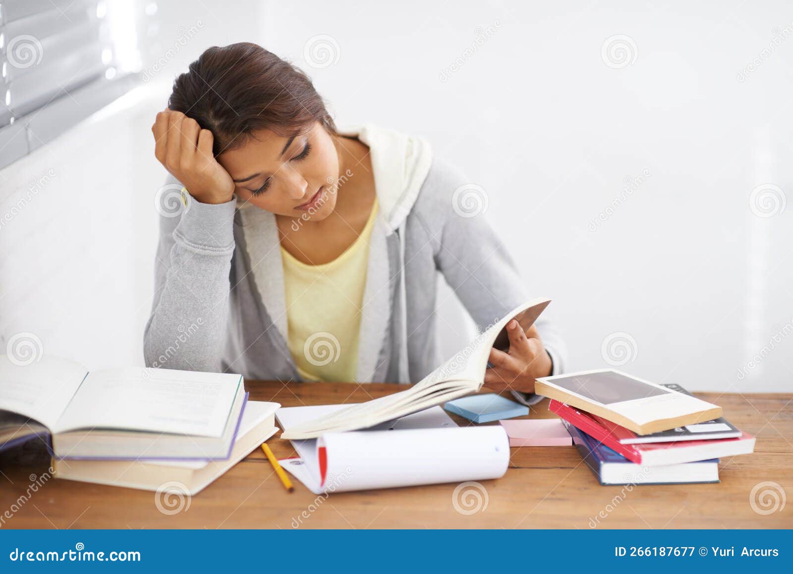 Shes Got Her Head in the Books...Head and Shoulders Shot of a College ... Shes Got Her Head in the Books...Head and Shoulders Shot of a College ...