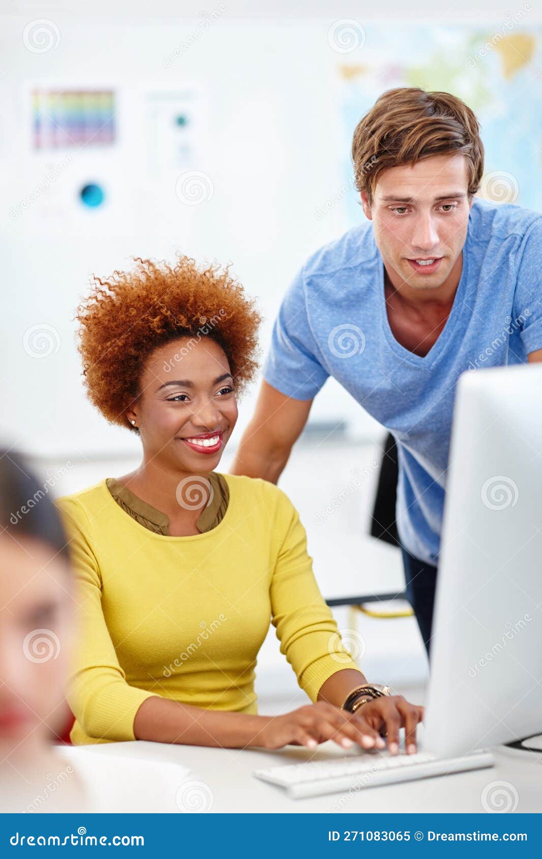 Shes Happy for His Help. Two Young Colleagues Working on a Computer ... Shes Happy for His Help. Two Young Colleagues Working on a Computer ...