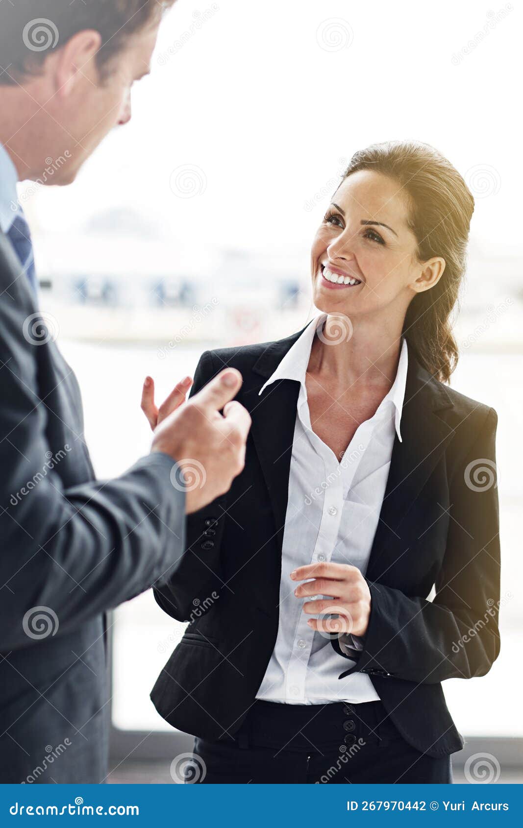 Shes Impressed with His Ideas. Two Businesspeople Talking in the Lobby ...