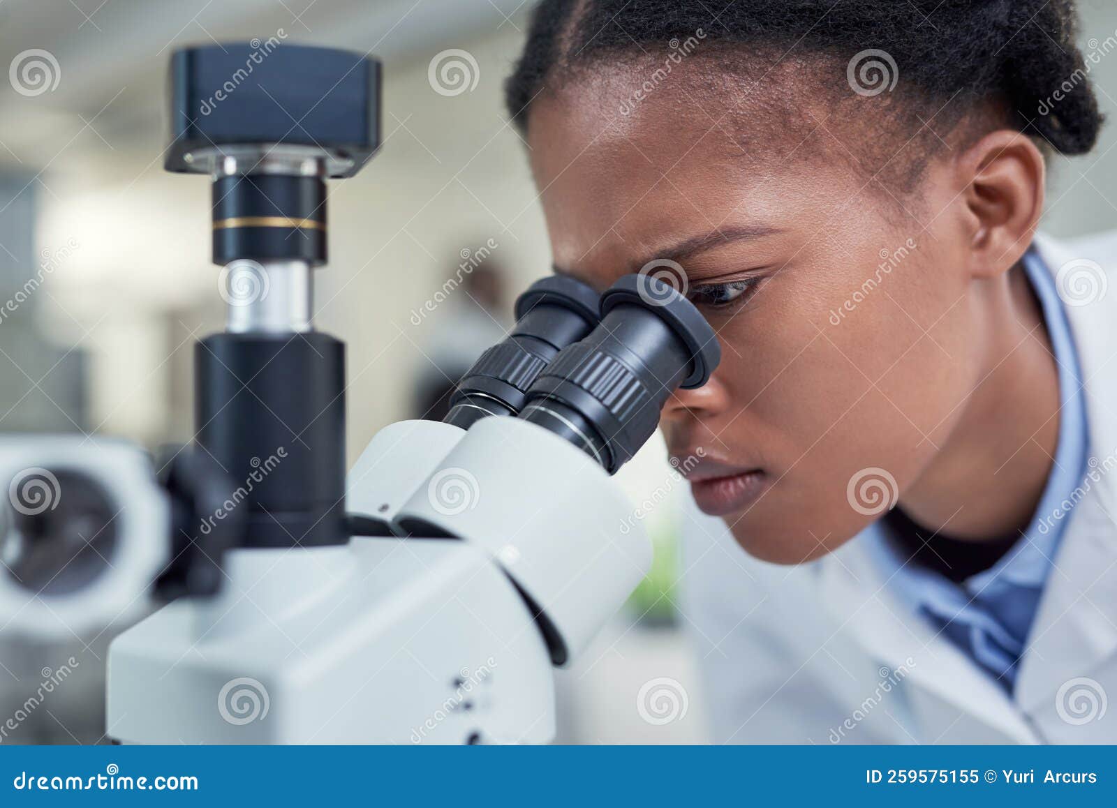 Shes Noticed Something...a Young Scientist Using a Microscope in a Lab ...