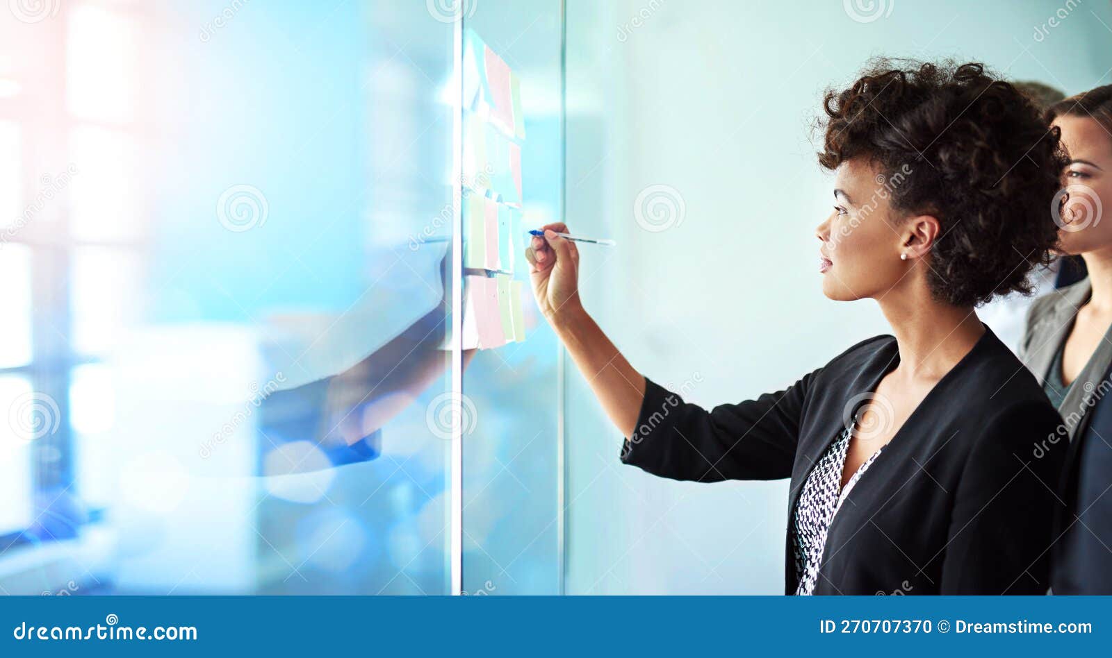 Shes Onto a Winning Idea. Shot of Colleagues Having a Brainstorming ...