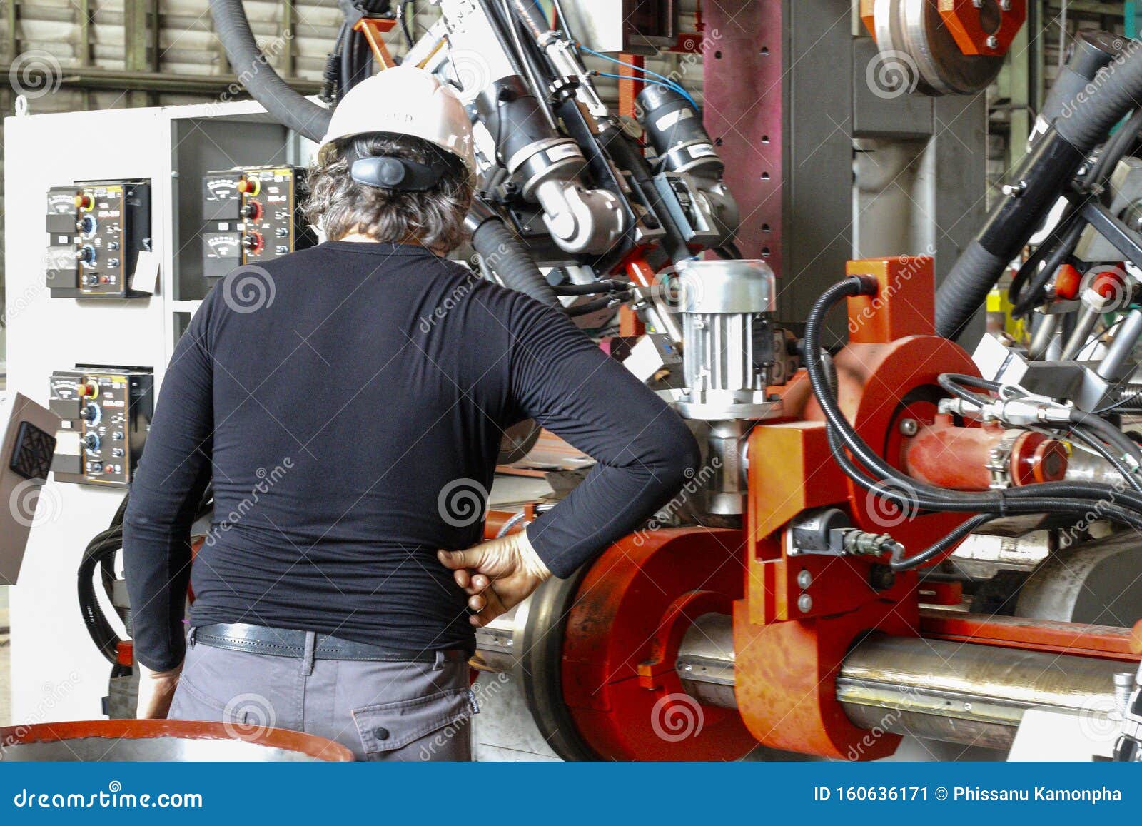 Shief Engineer Setting Up the Machine Steel Cutting Machine, Steel Bar ...