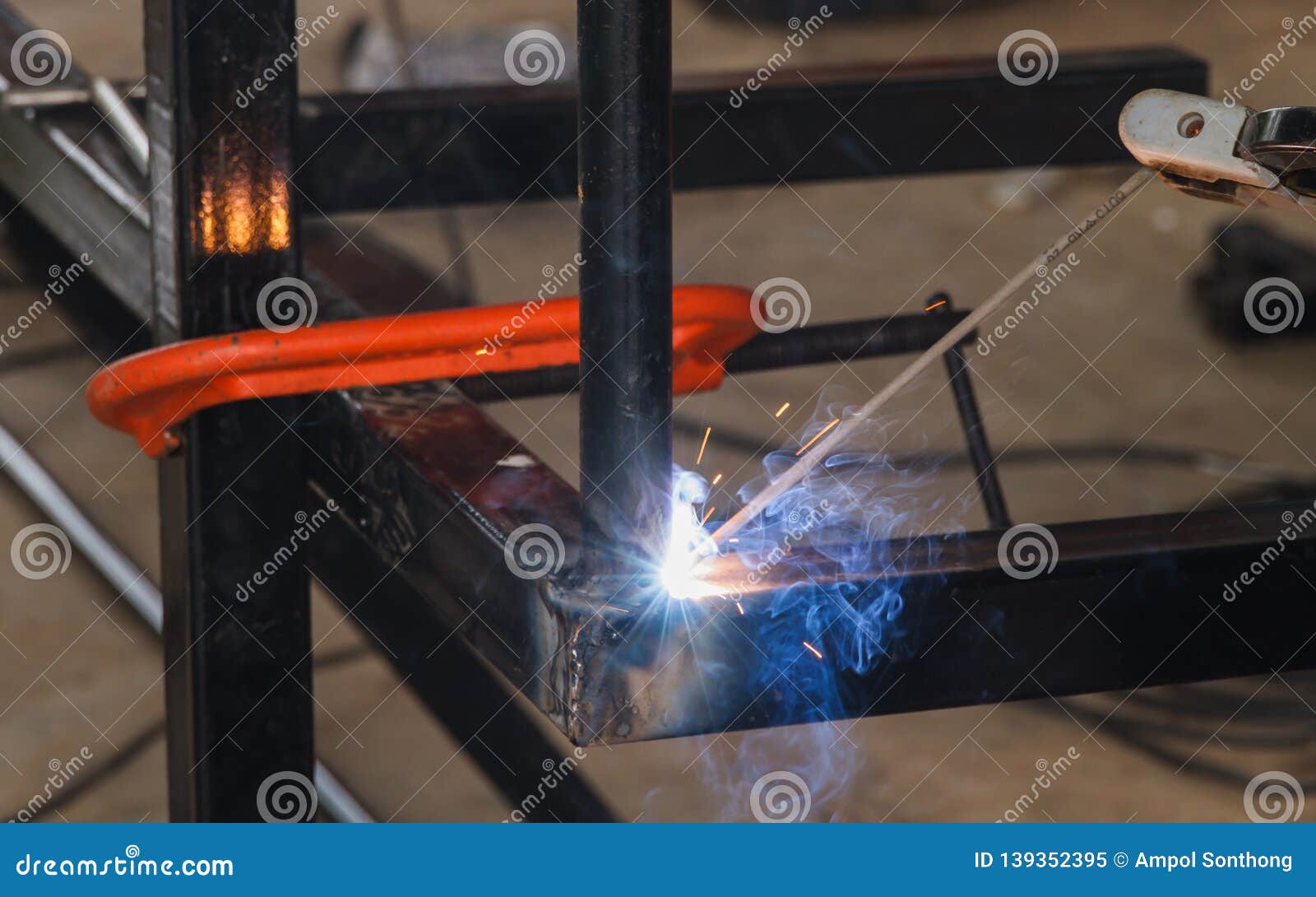 Shield Metal Arc Welding Welding and C-clamp. Stock Image - Image of ...