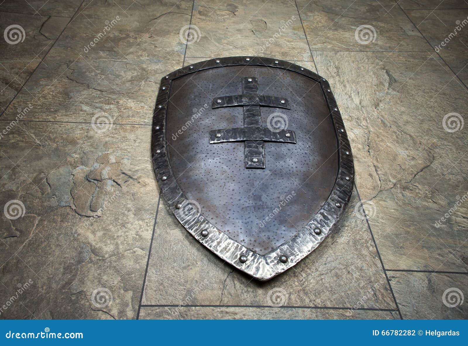 Shield on stone floor stock photo. Image of armed, barbarian - 66782282