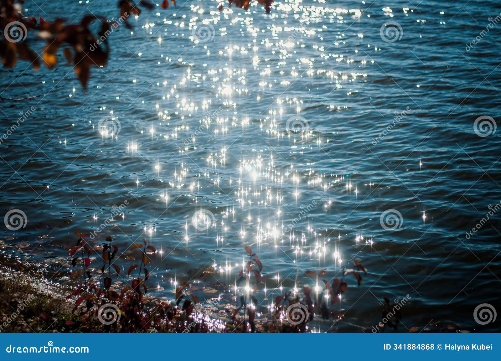 Shimmering Reflections on a Tranquil Water Surface at Sunset Stock ...