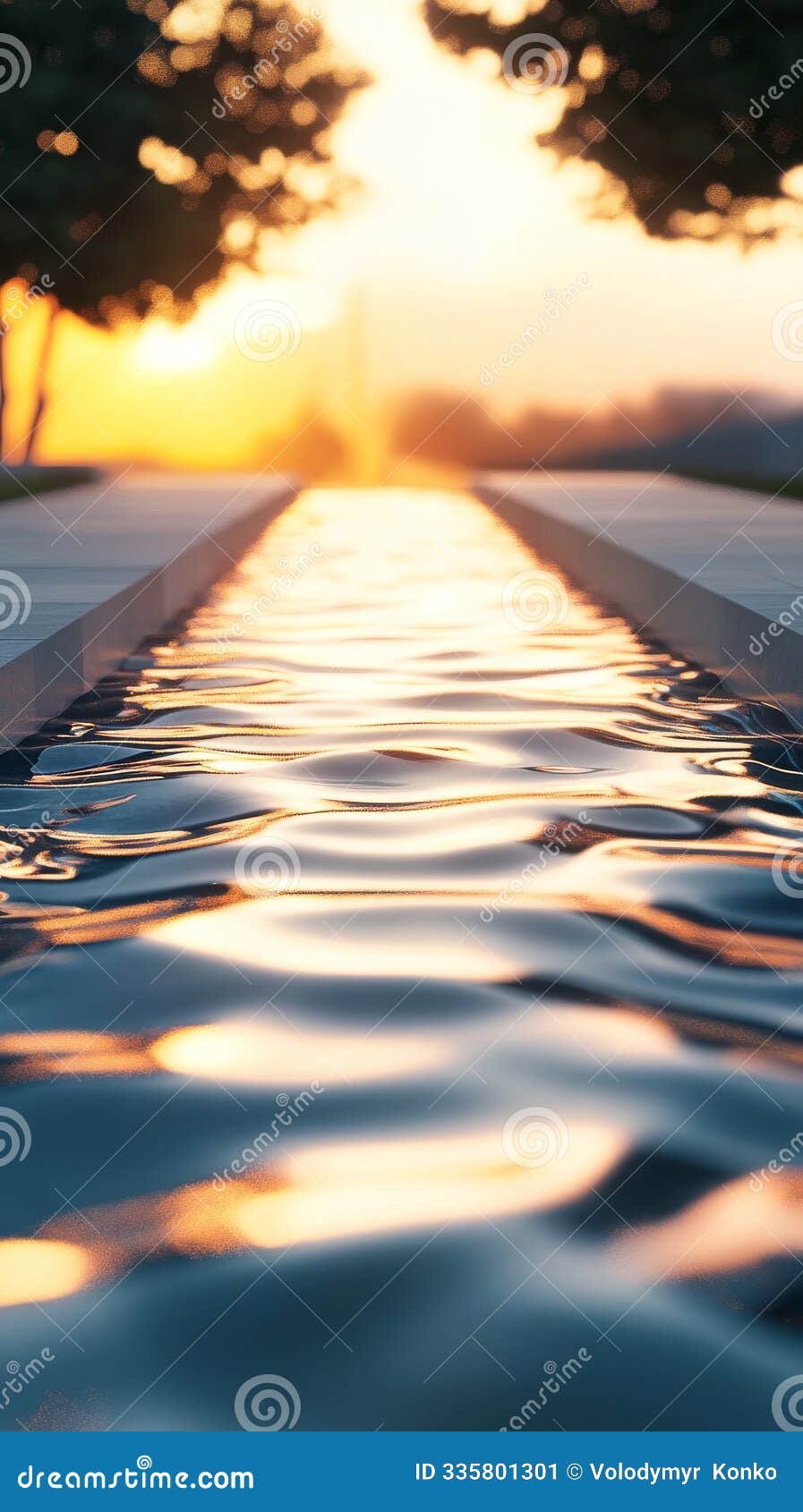 Shimmering Water Reflection during Sunset with Pathway and Trees Stock ...