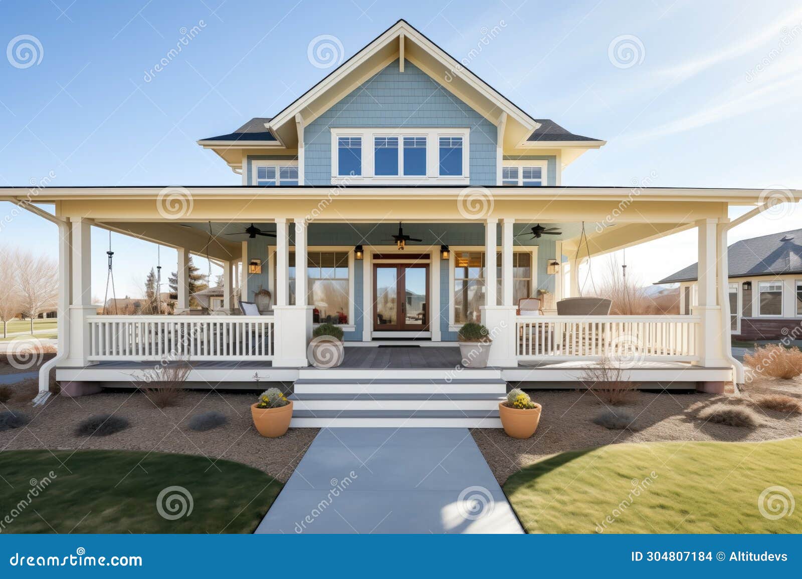 Shingle Home with Wraparound Porch and Stone Base Columns Stock Photo ...