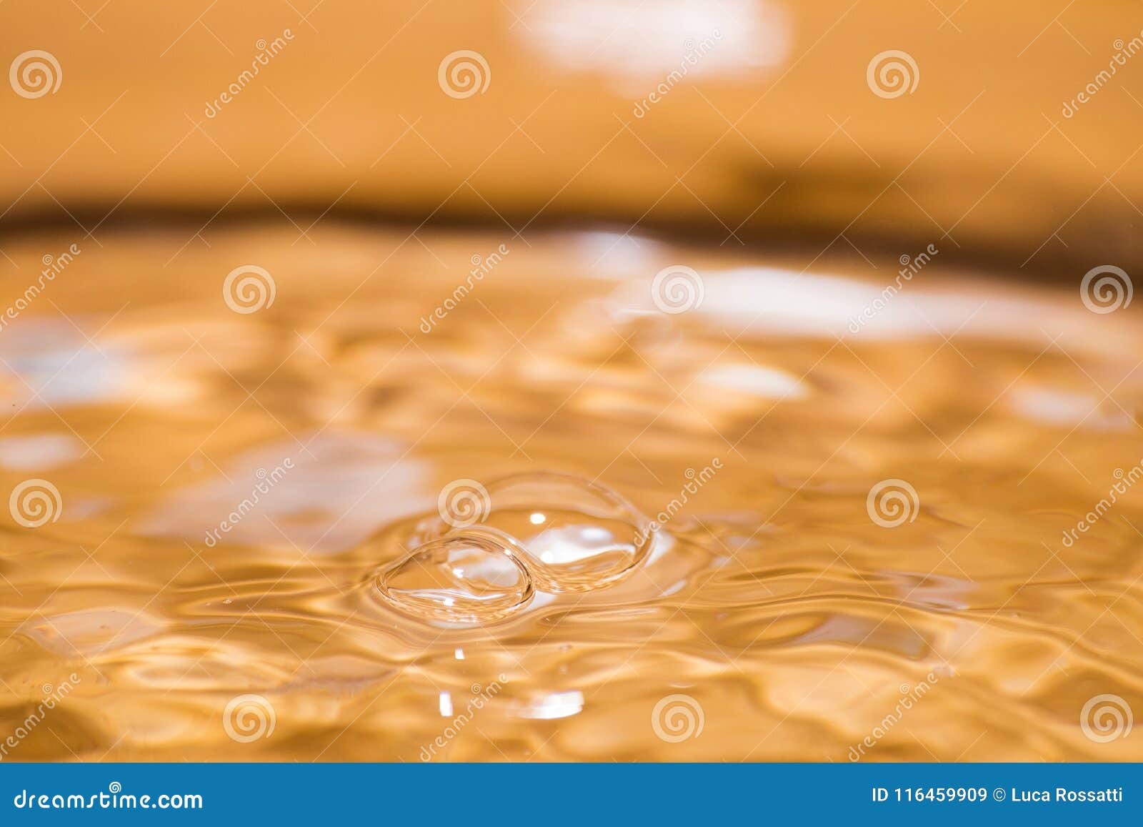 Shining Bubbles on Water Surface Colored of Orange Stock Image - Image ...