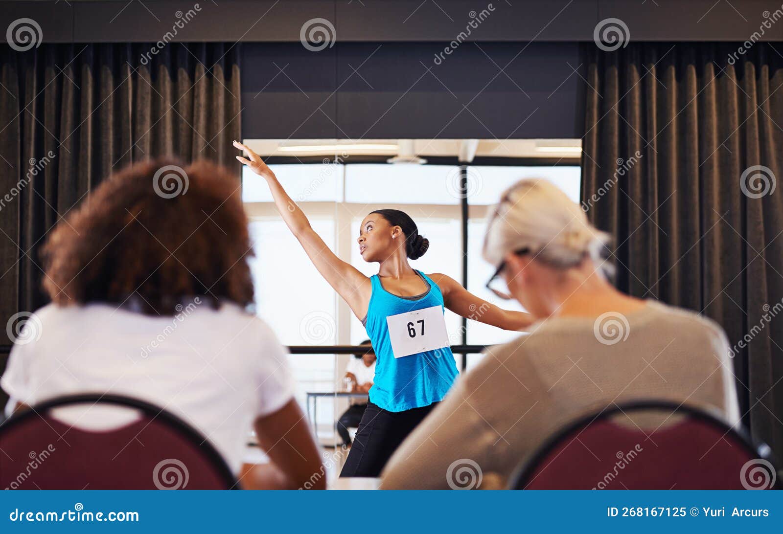 Shining on the Dance Floor. a Female Dancer Performing before the ...