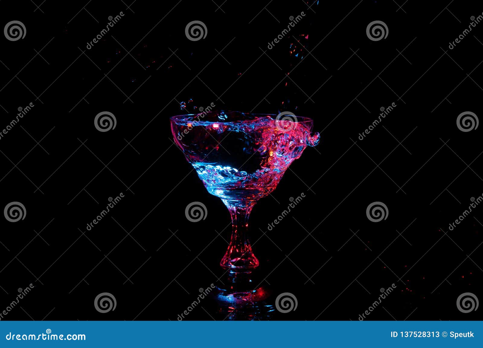 Shining Liquid Spilling Over the Edge of a Fancy Glass Stock Image ...