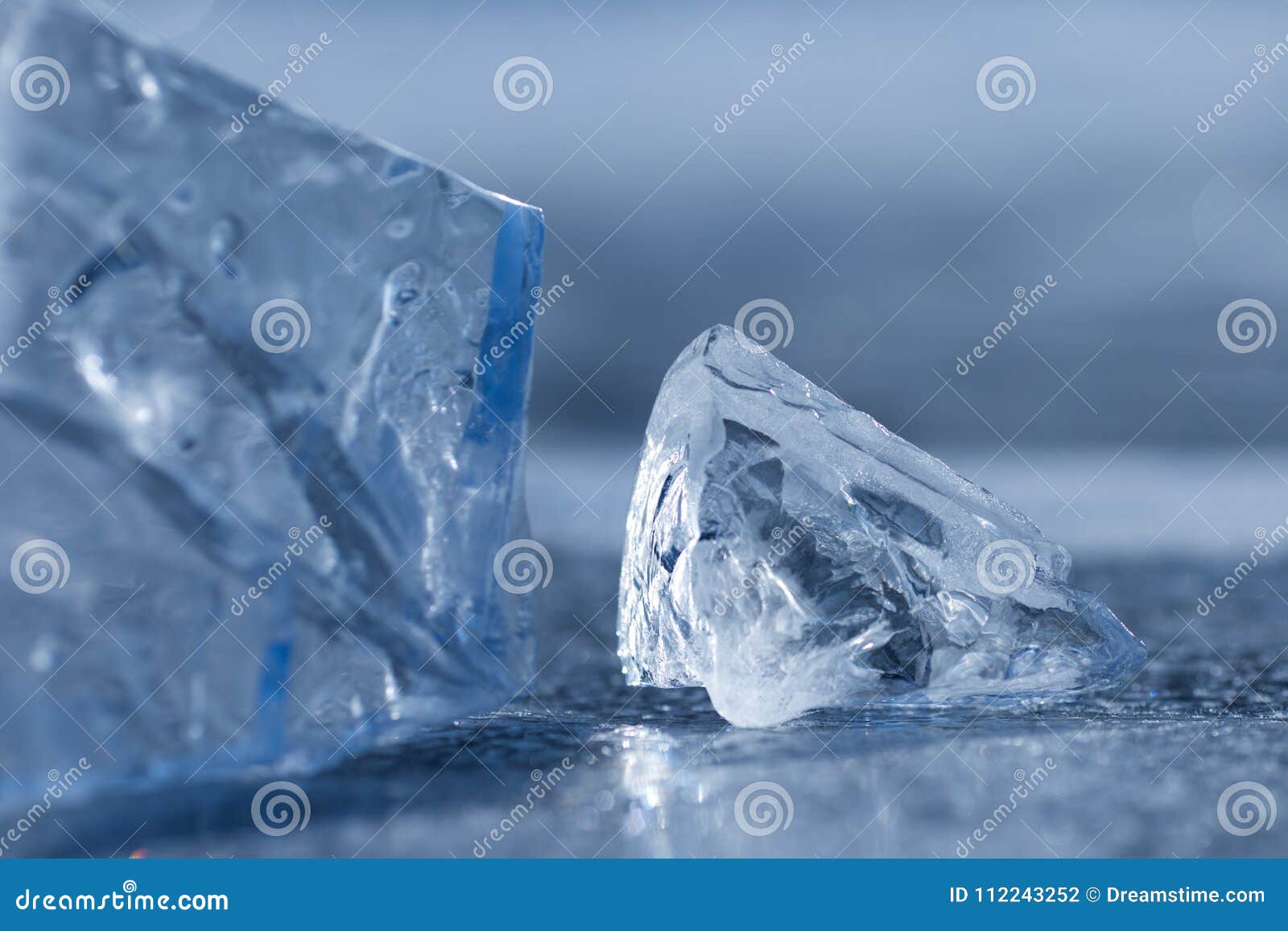 Shining Piece of Ice Lies on Lake Ice. Stock Photo - Image of ...