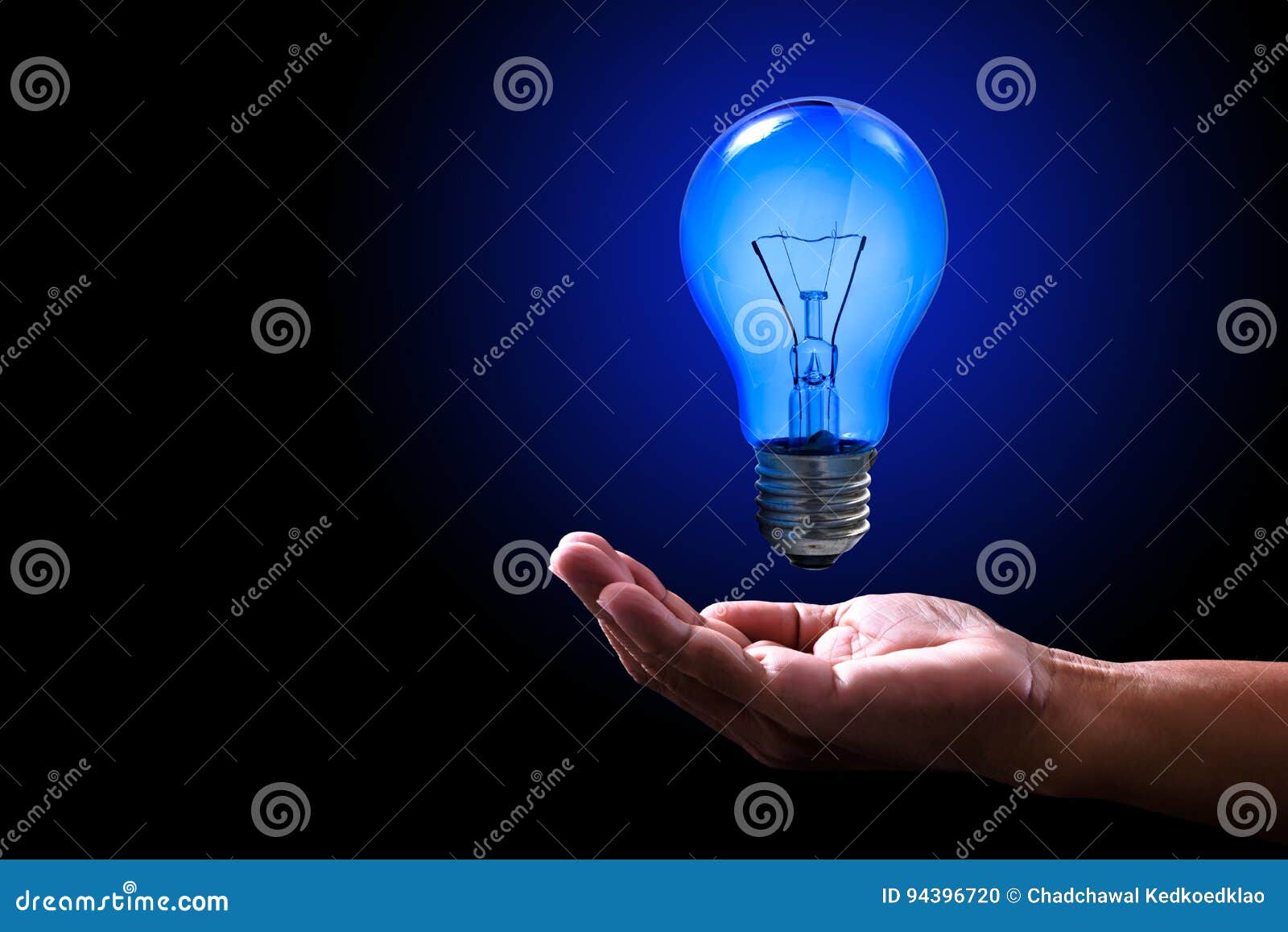 Shiny Blue Light Bulb and Power Human Hand Stock Photo - Image of hand ...
