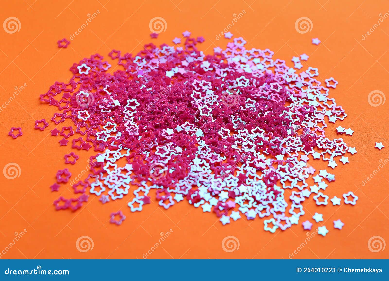 Shiny Bright Star Shaped Glitter on Orange Background Stock Image ...