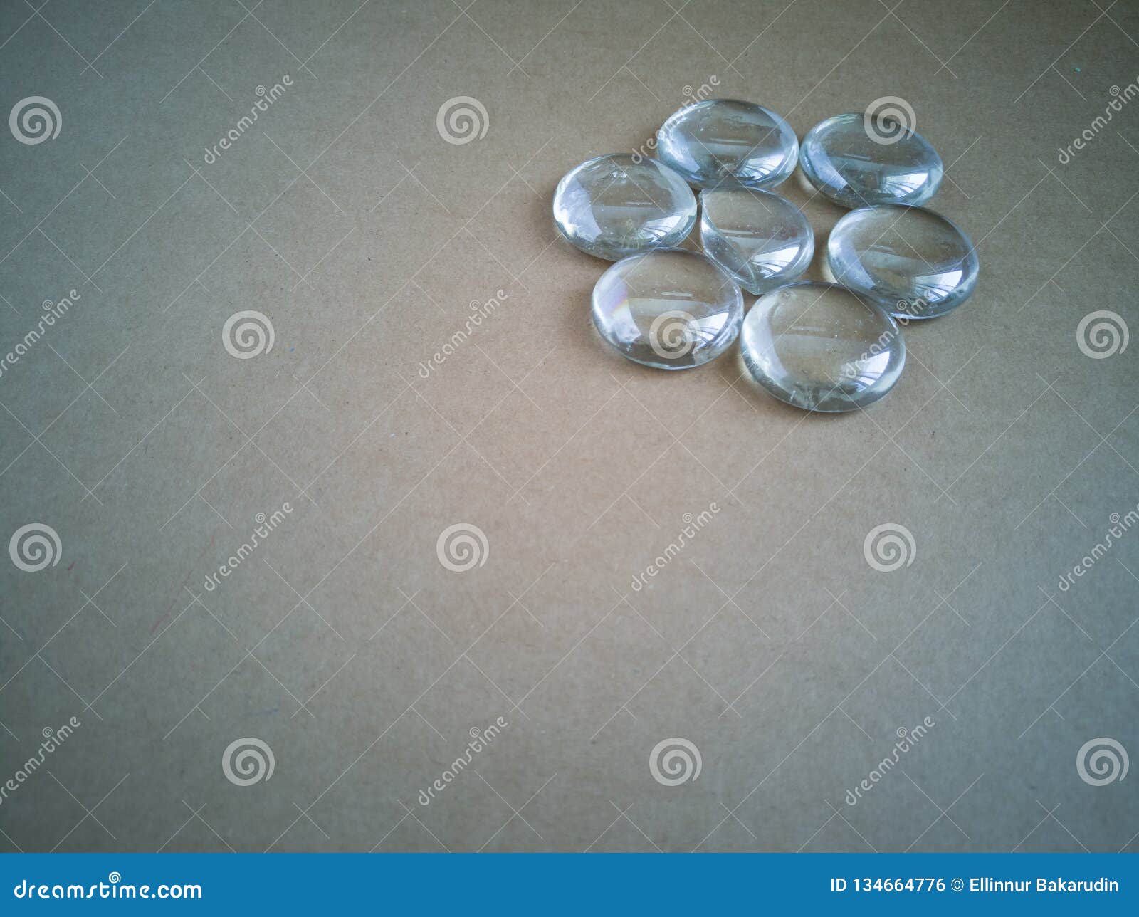 Clear Marbles with Light Reflections on a Brown Background. Stock Photo ...