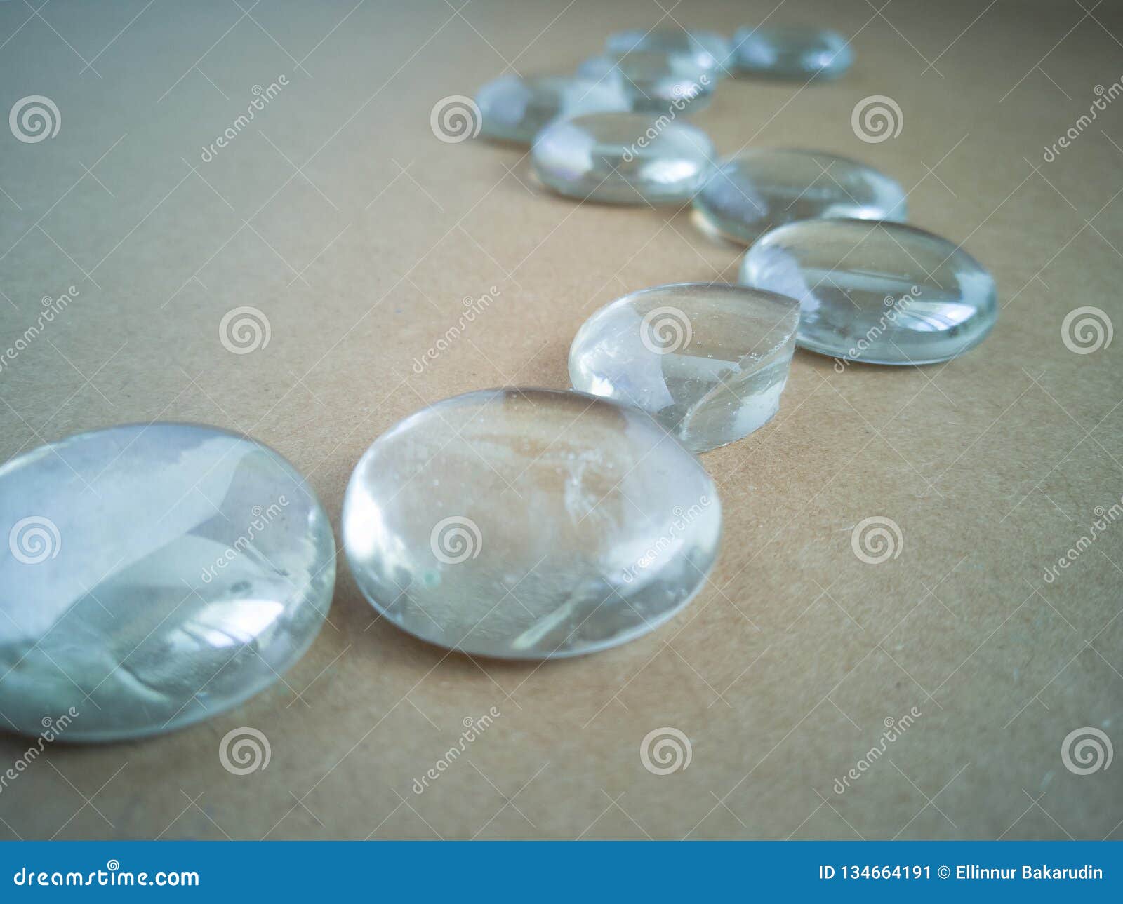 Clear Marbles with Light Reflections on a Brown Background. Stock Image ...