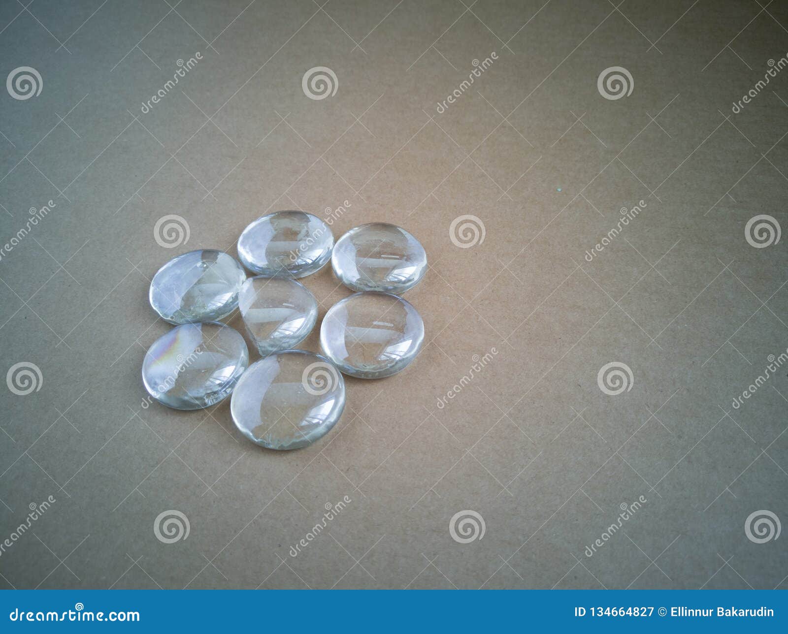 Clear Marbles with Light Reflections on a Brown Background. Stock Image ...