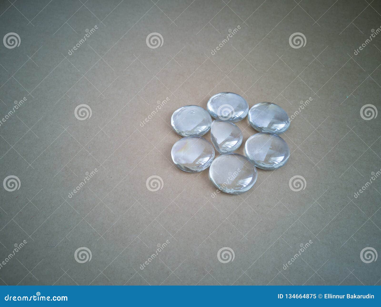 Clear Marbles with Light Reflections on a Brown Background. Stock Image ...